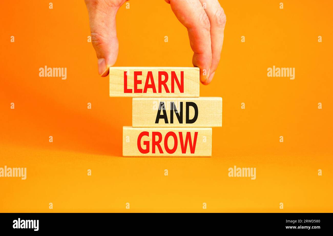 Learn and grow symbol. Concept word Learn And Grow on beautiful wooden ...