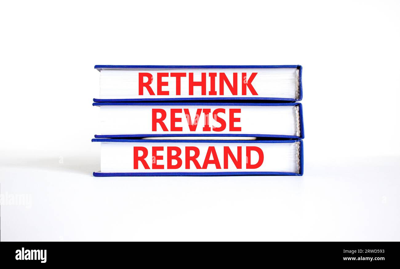 Rethink revise rebrand symbol. Concept word Rethink Revise Rebrand on beautiful books. Beautiful ...