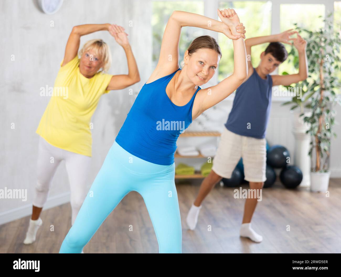 Three Generations Of Mother Grandmother And Teen Son Learn Sports