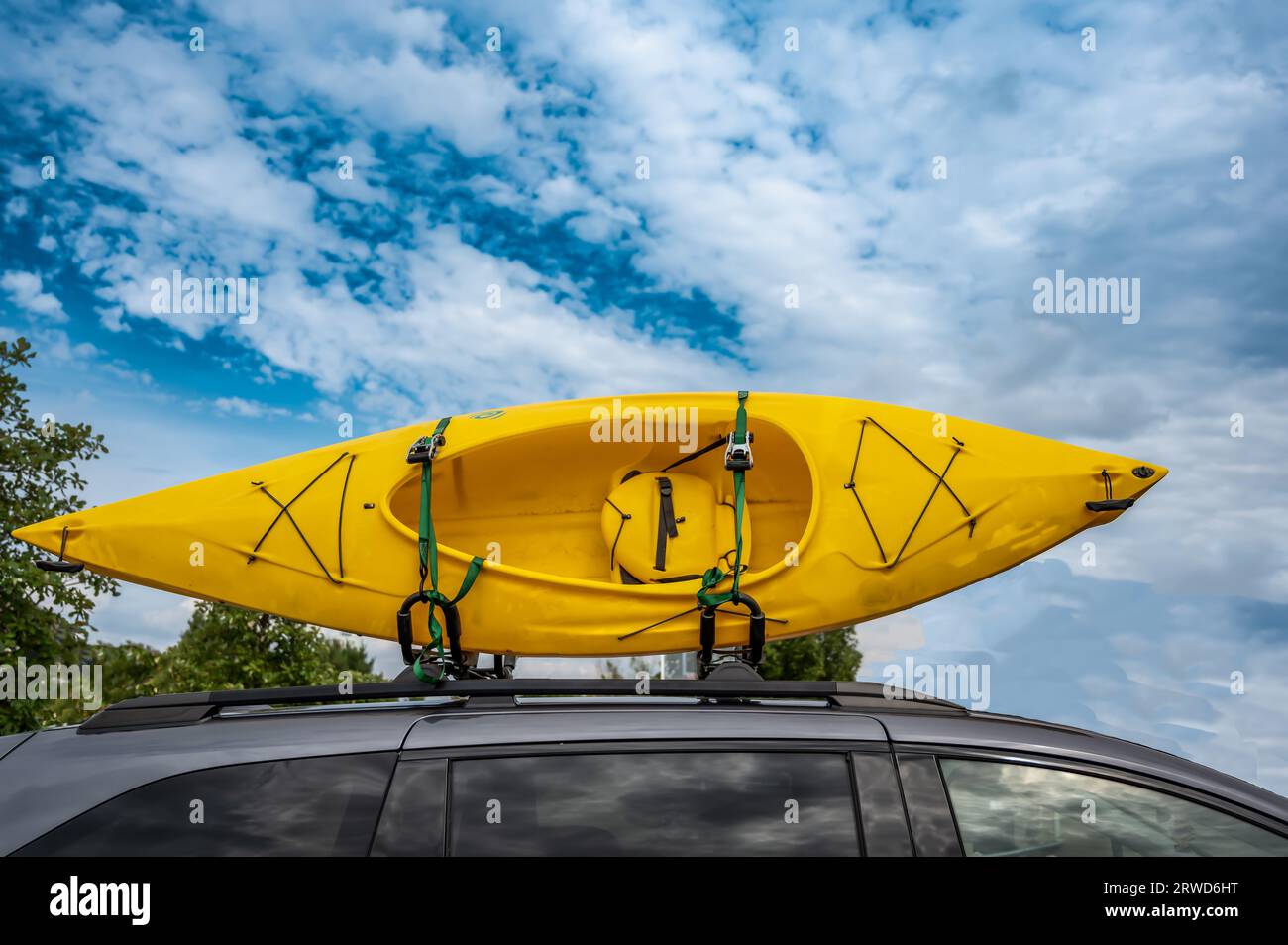 Roof mounted kayak on top of a van for transportation Stock Photo - Alamy