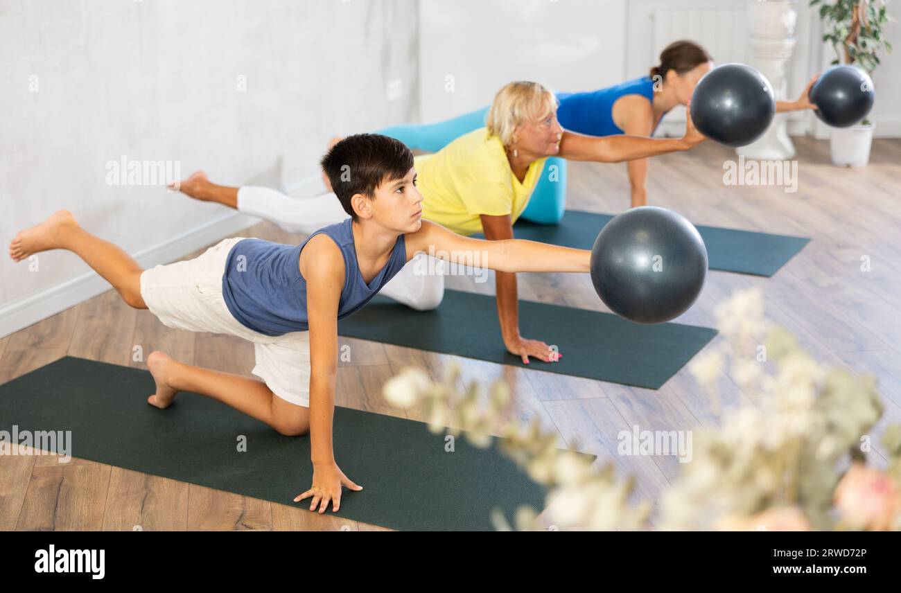 Three generations family of grandmother, mother and grandson perform ...