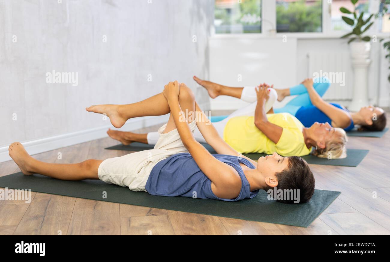 Knees To Chest Pose - Apanasana Stock Photo - Alamy