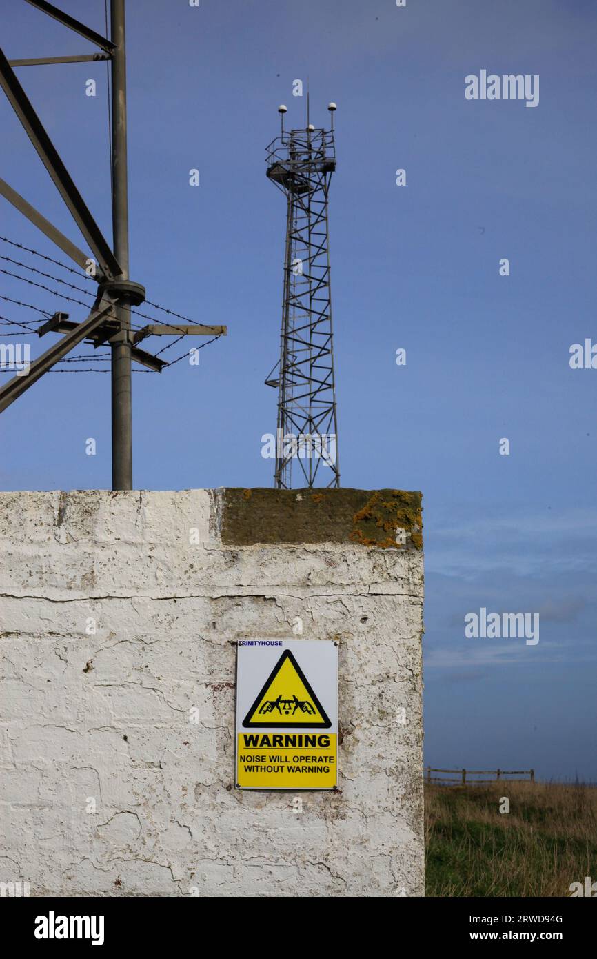 Noise will operate without warning - off sign with fingers in ears at ...