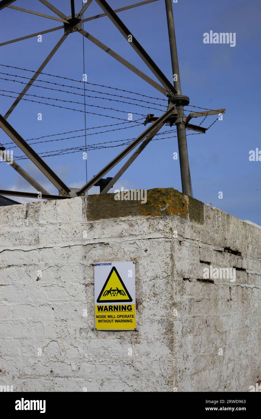 Noise will operate without warning - off sign with fingers in ears at ...