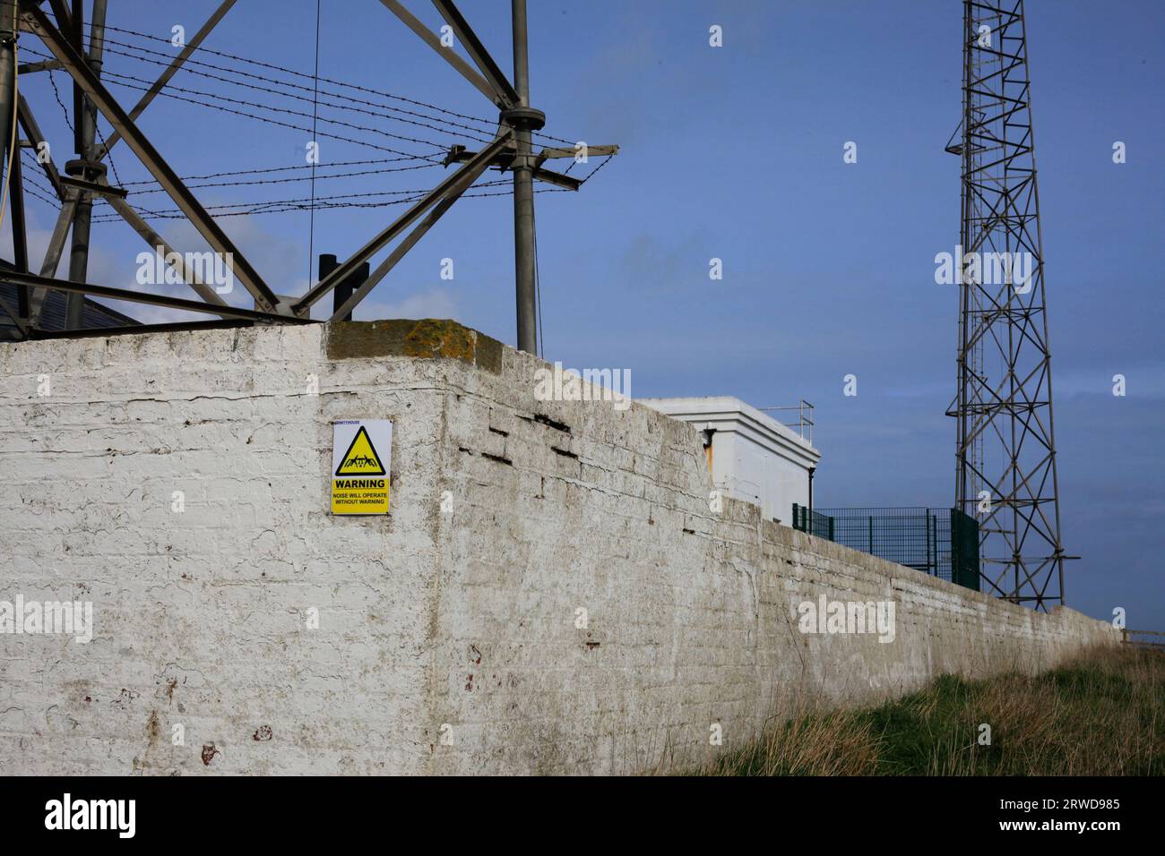 Noise will operate without warning - off sign with fingers in ears at ...