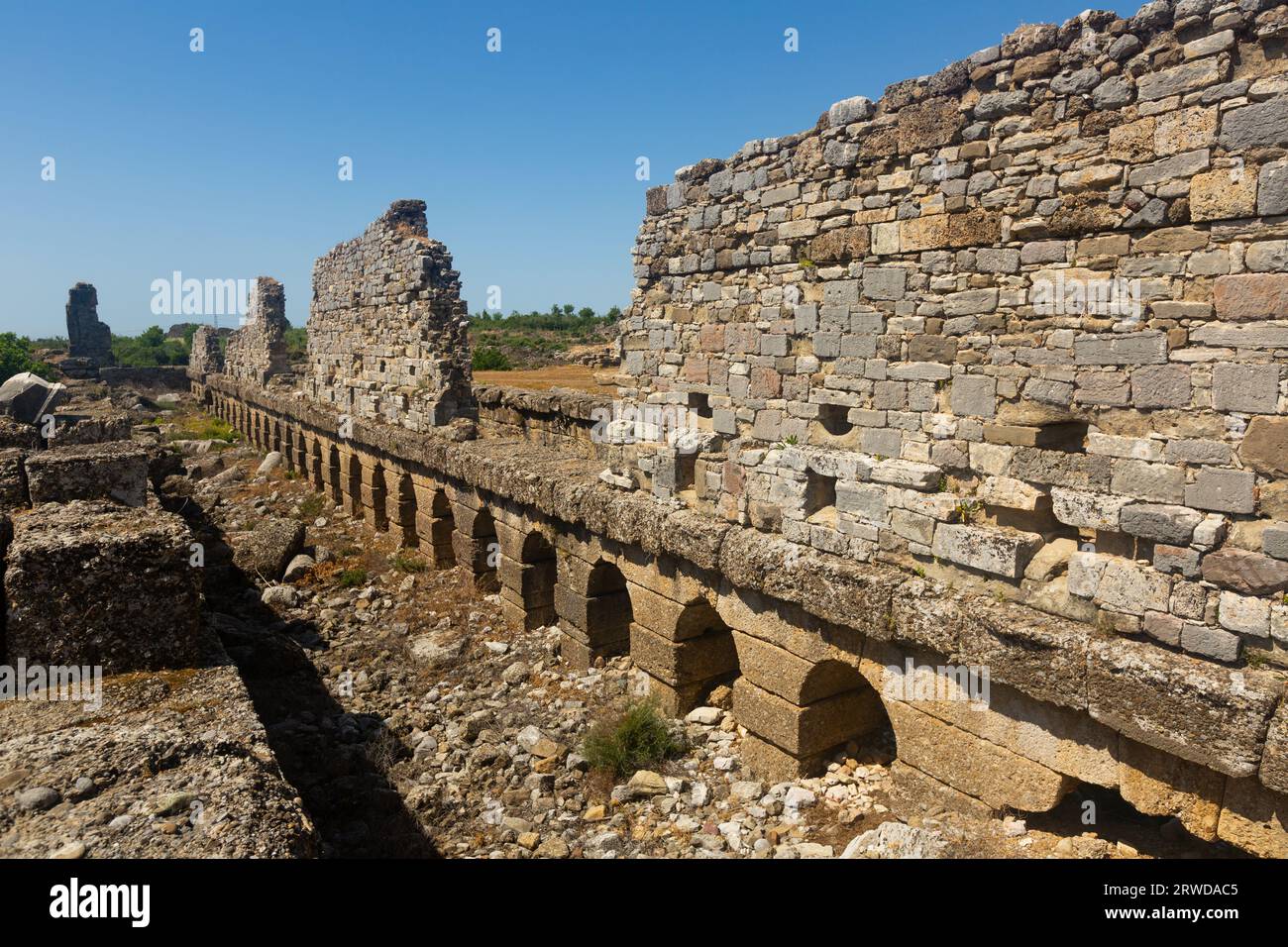 Remains of foundations of basilica in ancient city of Aspendos, Turkey ...