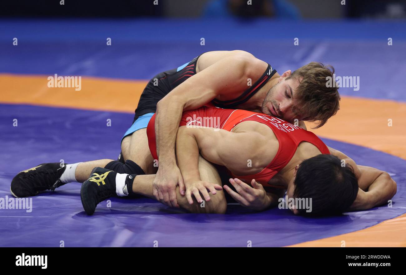 Stevan Andria Micic of Serbia (blue) competes after winning the men's ...