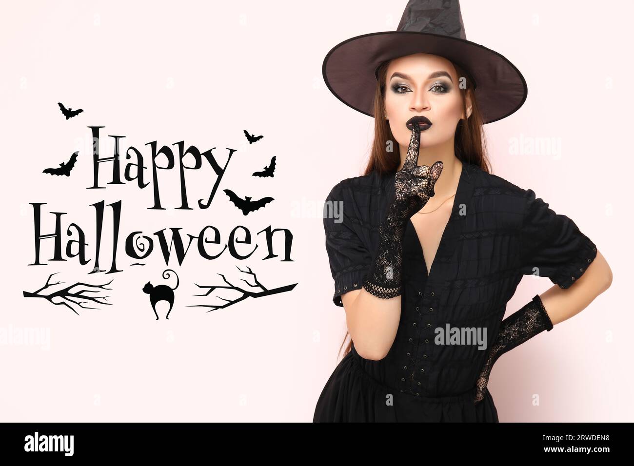 Young witch showing silence gesture and text HAPPY HALLOWEEN on white ...