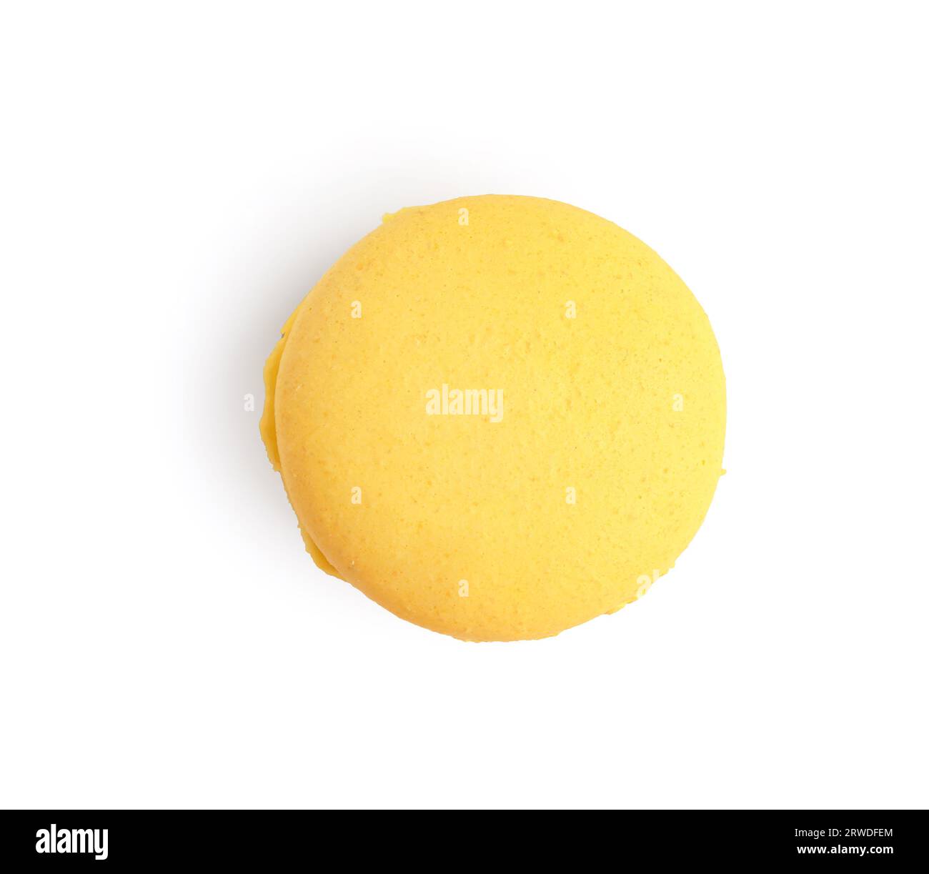 Sweet yellow macaroon on white background Stock Photo - Alamy