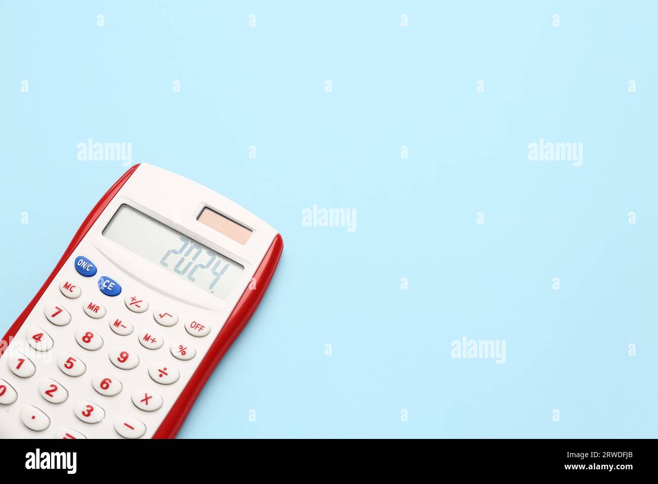 Calculator with number 2024 on blue background Stock Photo - Alamy