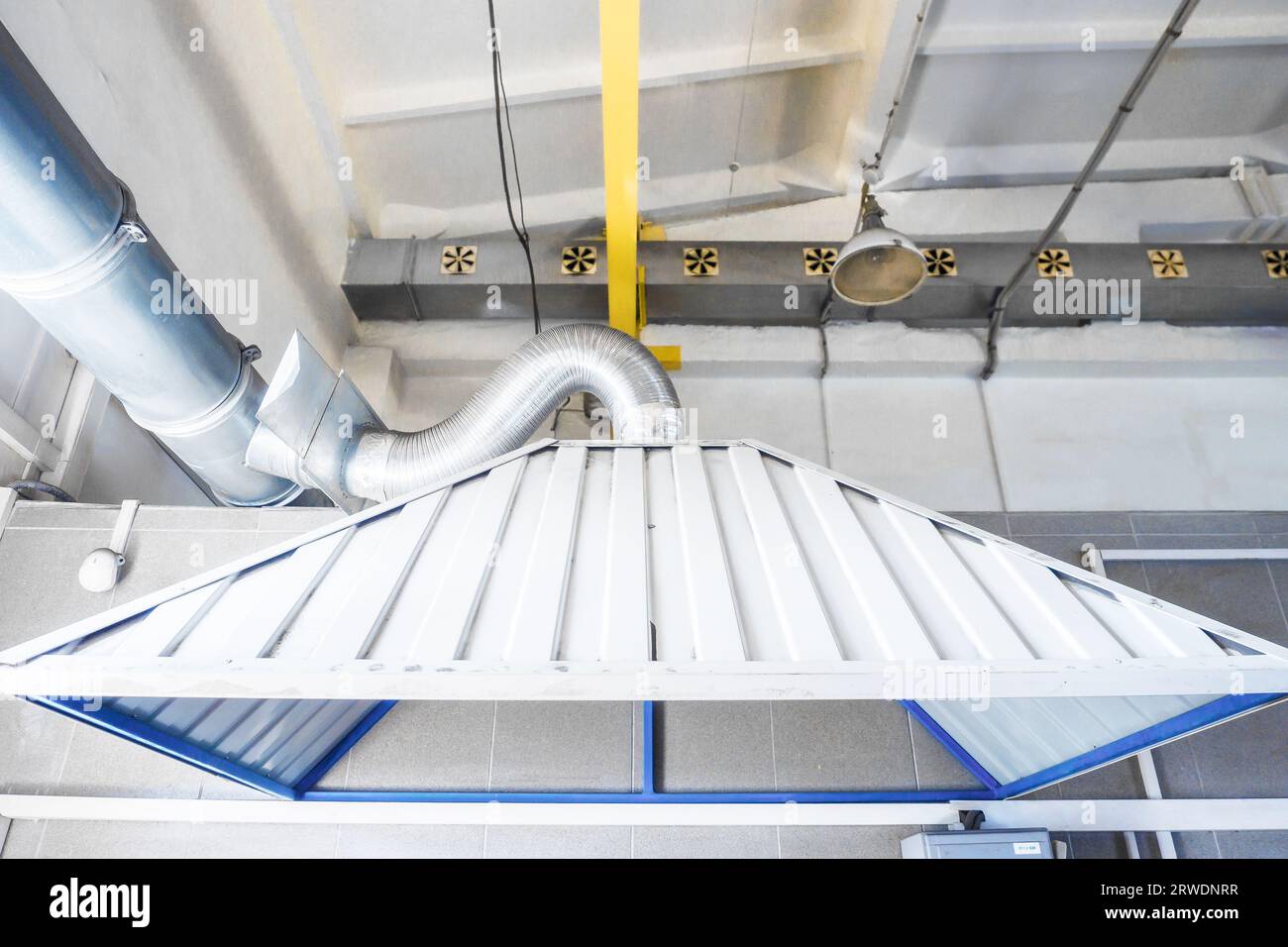 Industrial hood in production workshop. Room ventilation system ...