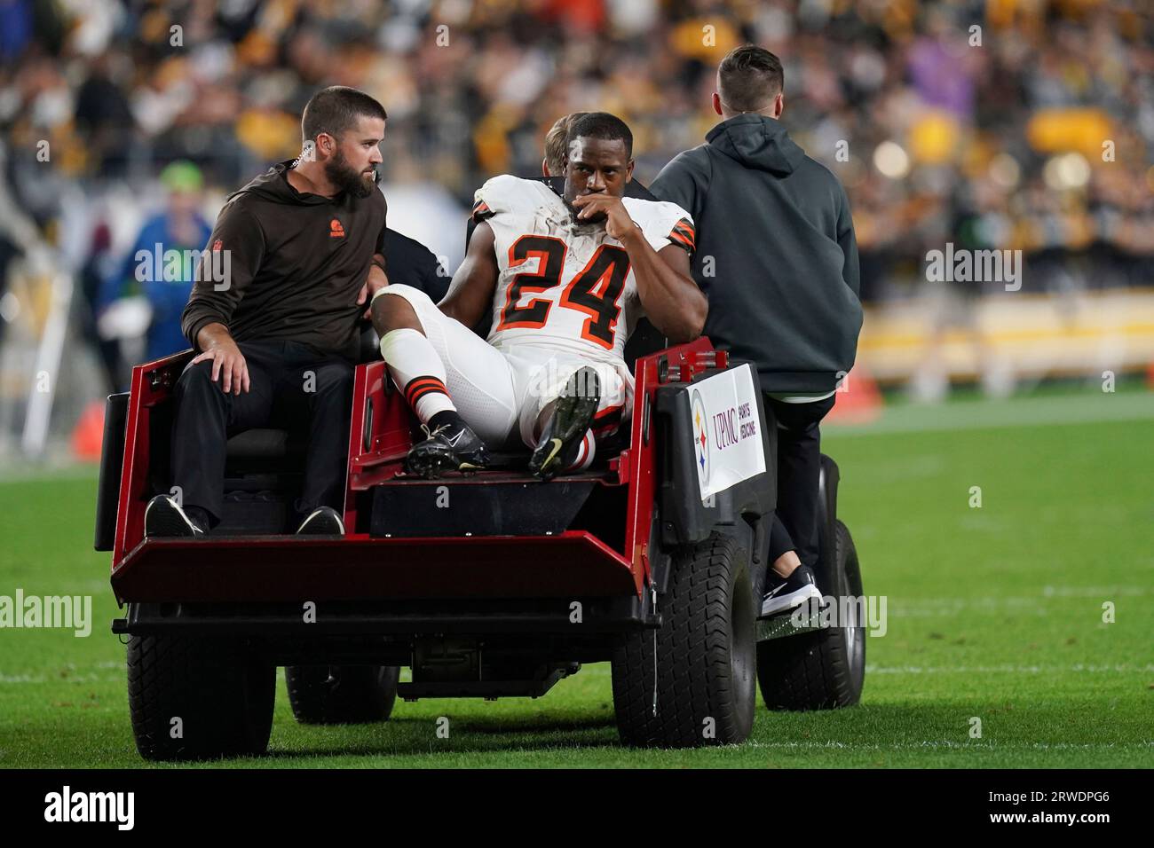 Cleveland Browns running back Nick Chubb is cared off the field with an ...