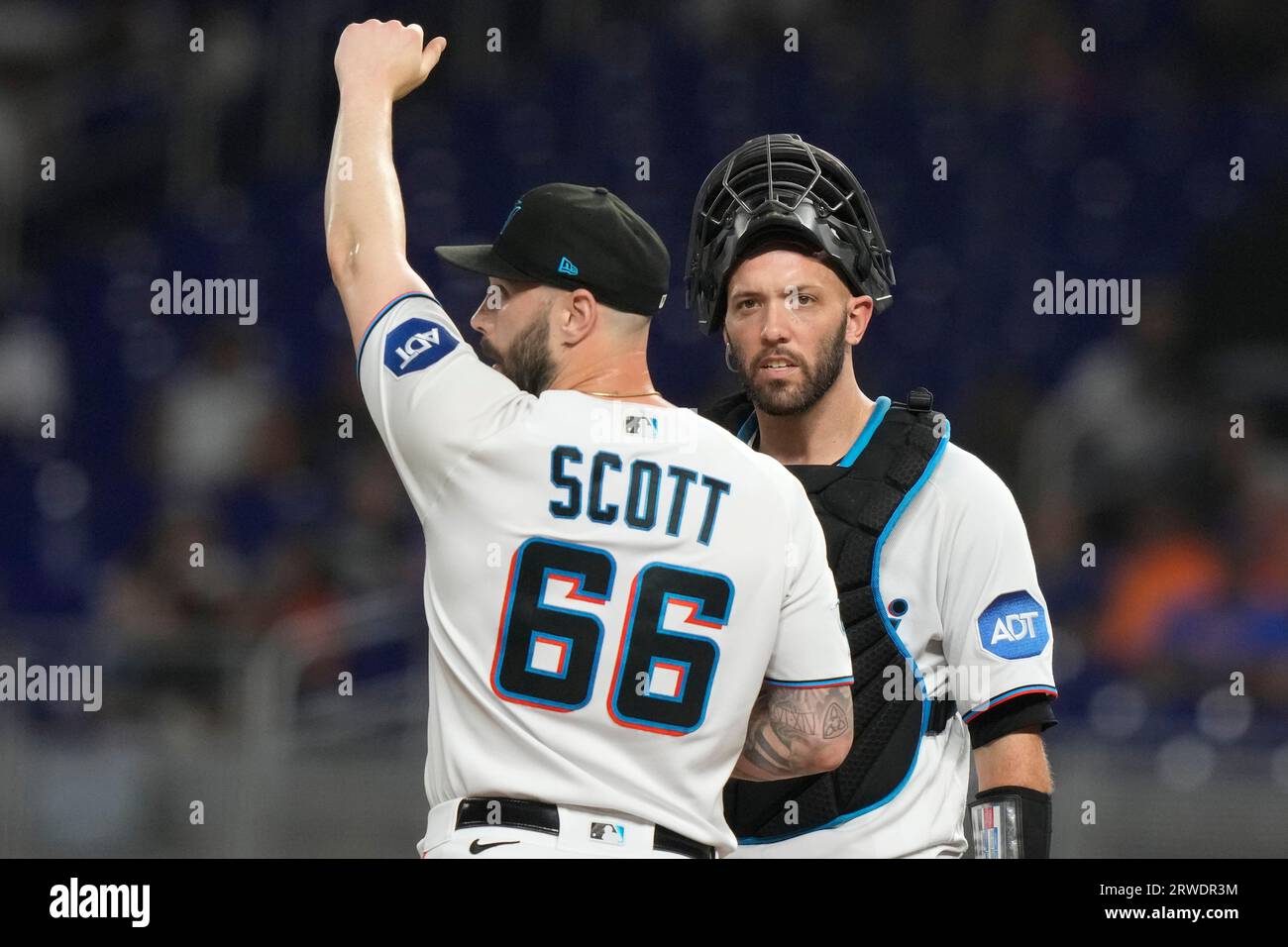 Miami Marlins relief pitcher Tanner Scott (66) talks on the mound with ...