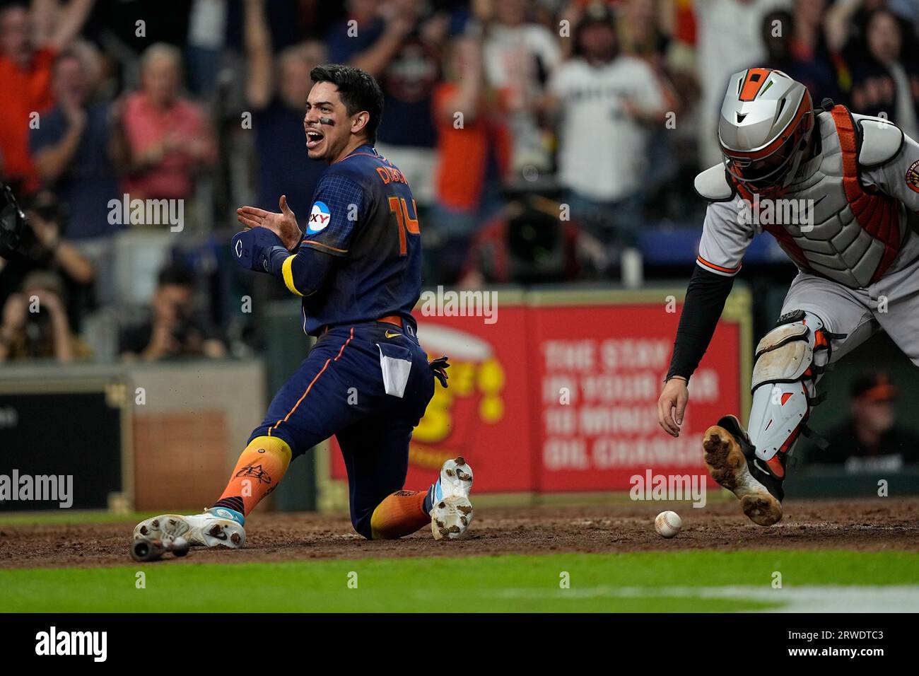 Houston Astros' Mauricio Dubon (14) reacts after scoring a run as ...
