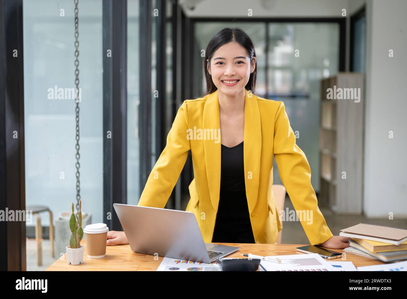 A confident and attractive millennial Asian businesswoman or female ...