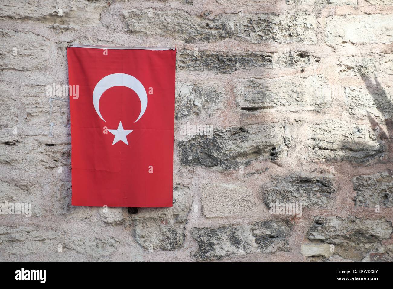 Turkish flag hanging on the window Stock Photo - Alamy