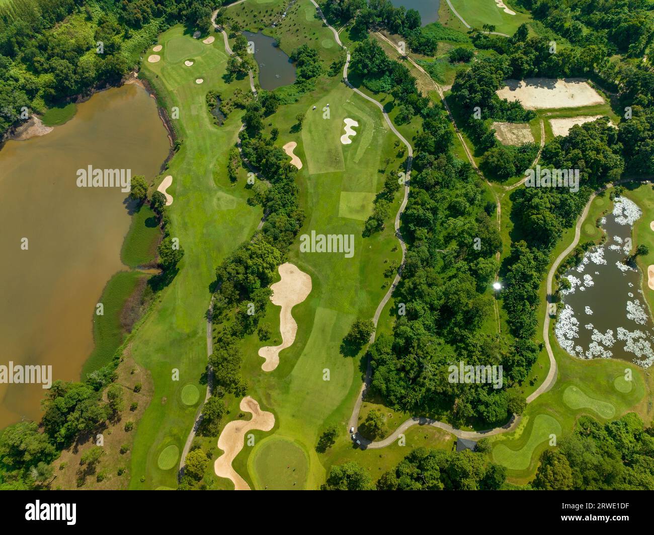 Aerial view drone shot of beautiful green golf field fairway and ...