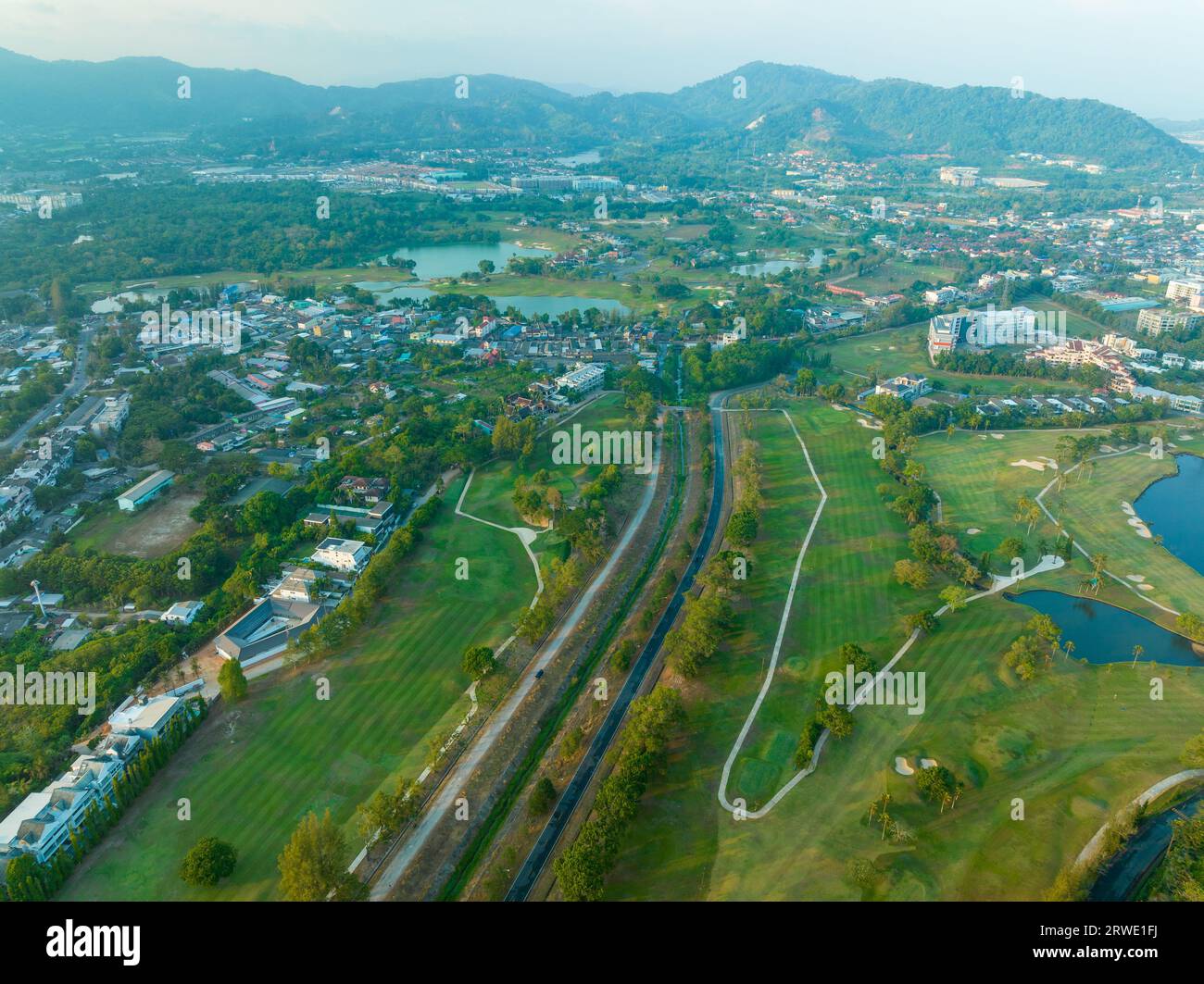 Aerial view drone shot of beautiful green golf field fairway and ...