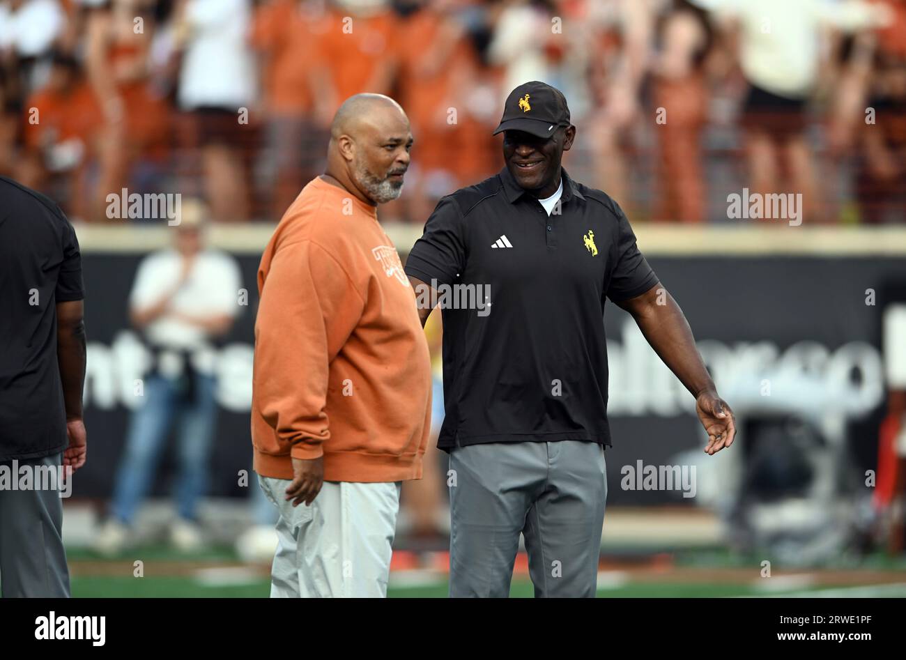 AUSTIN, TX - SEPTEMBER 16: Texas Longhorns assistant coach Bo Davis (left) visits with Wyoming ...