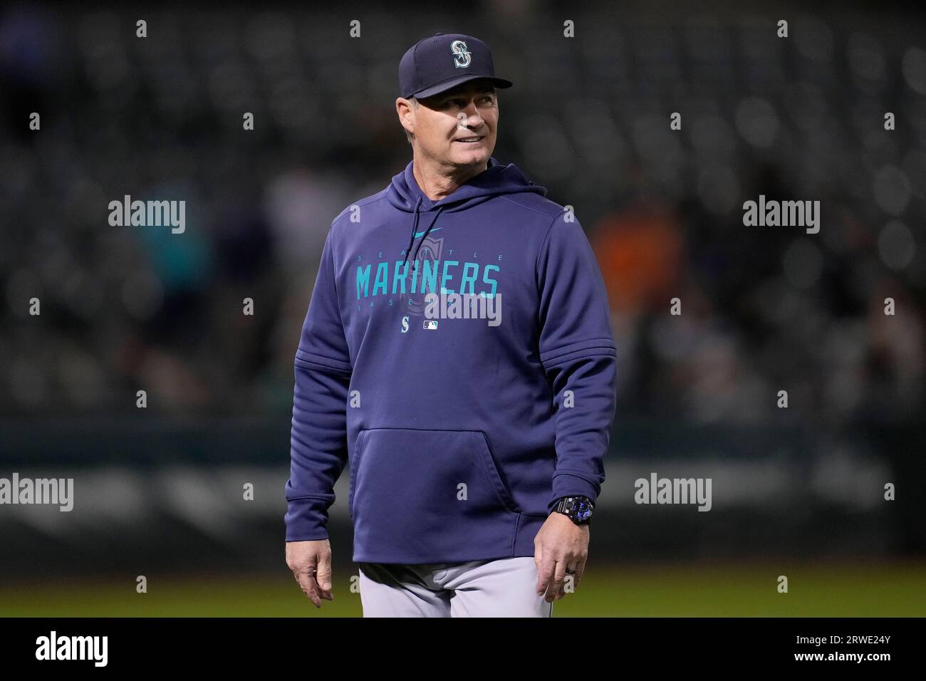 Seattle Mariners manager Scott Servais walks to the dugout after making ...