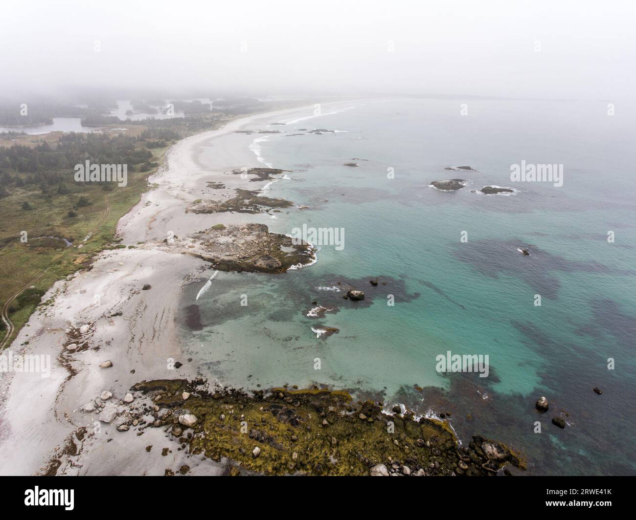 Exploring the beach in the mist morning at Kejimkujik National Park ...