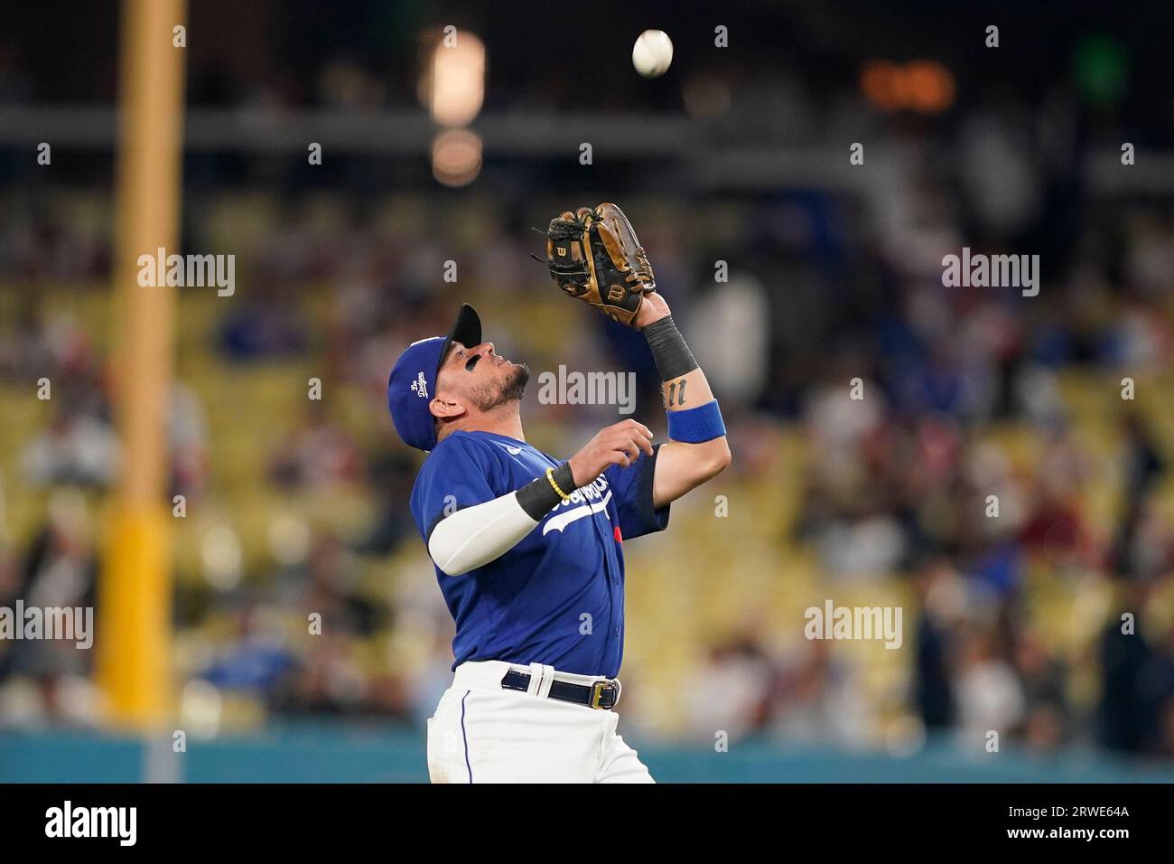 Los Angeles Dodgers shortstop Miguel Rojas catches a pop ball hit by ...