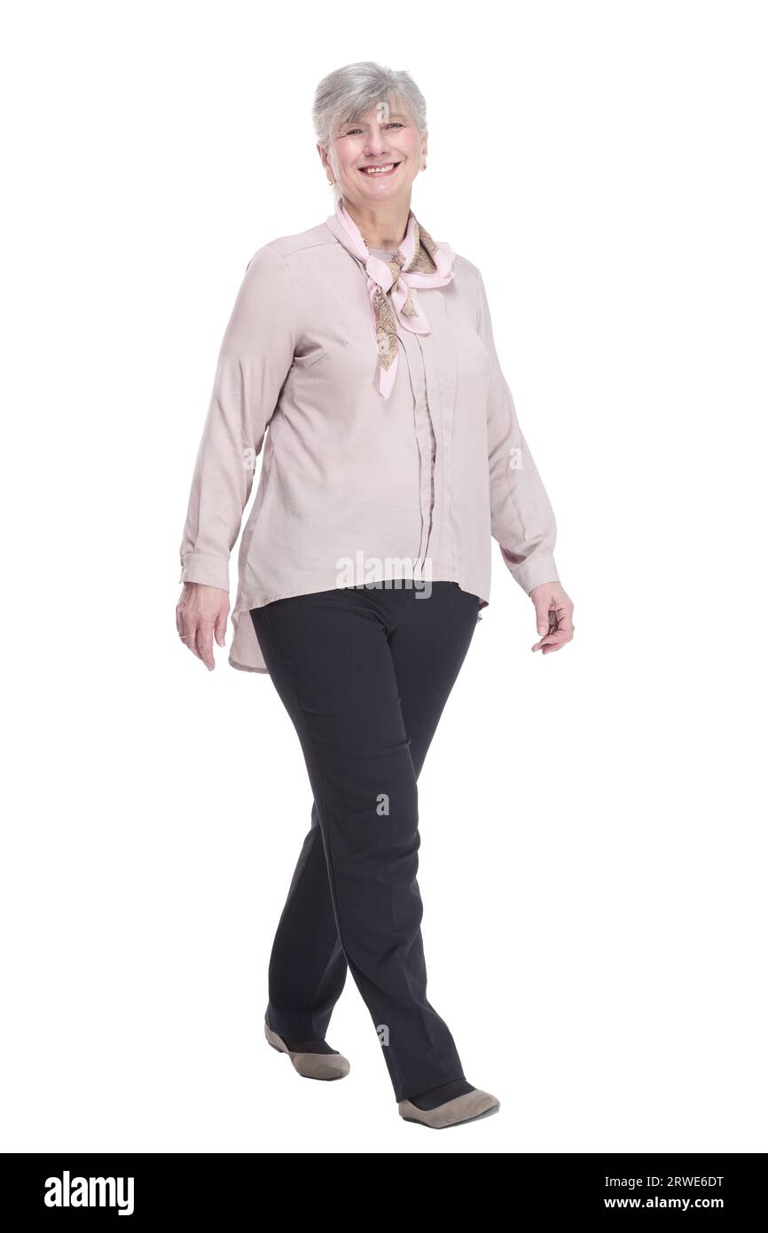 confident old lady striding forward. isolated on a white background ...