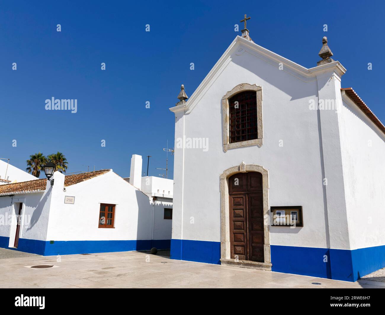 Church painted blue and white in village square, Porto Covo, Sines ...