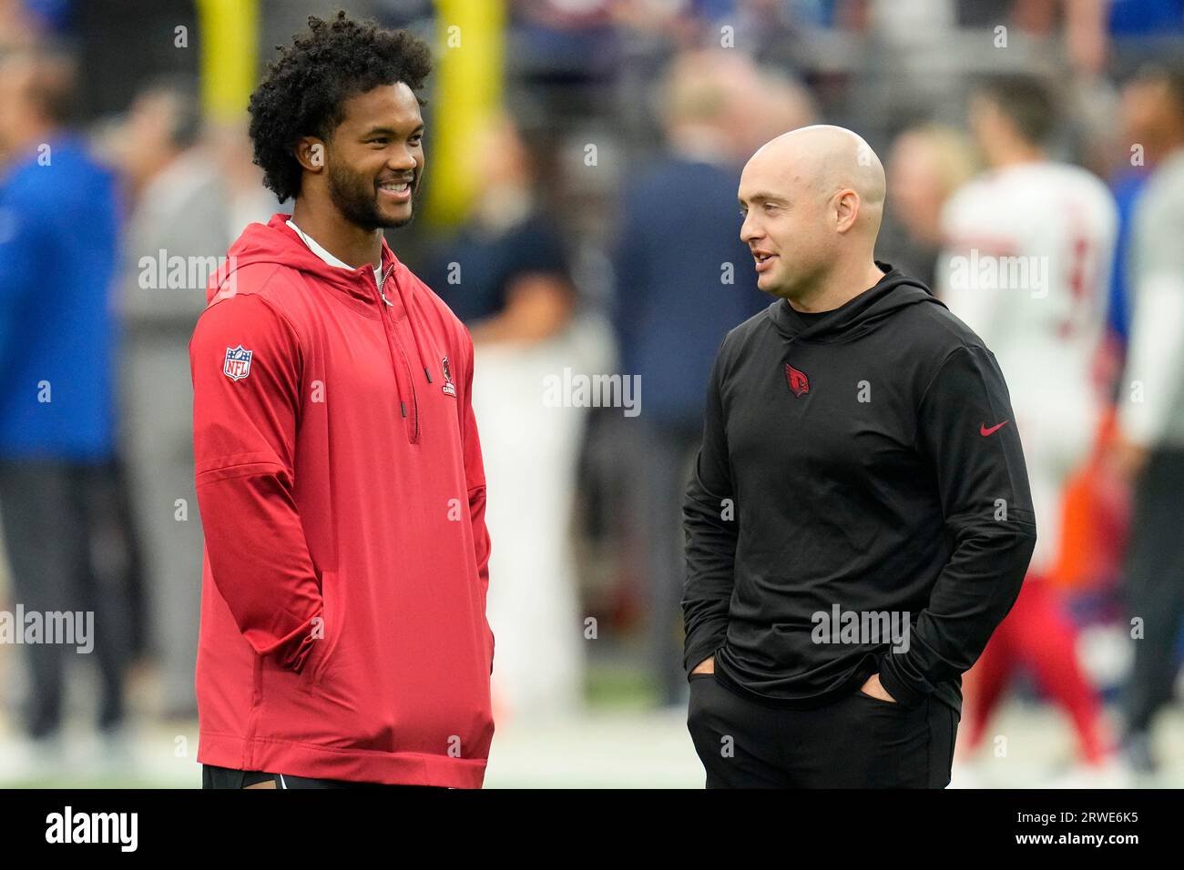 Injured Arizona Cardinals quarterback Kyler Murray, left, talks with Cardinals offensive ...