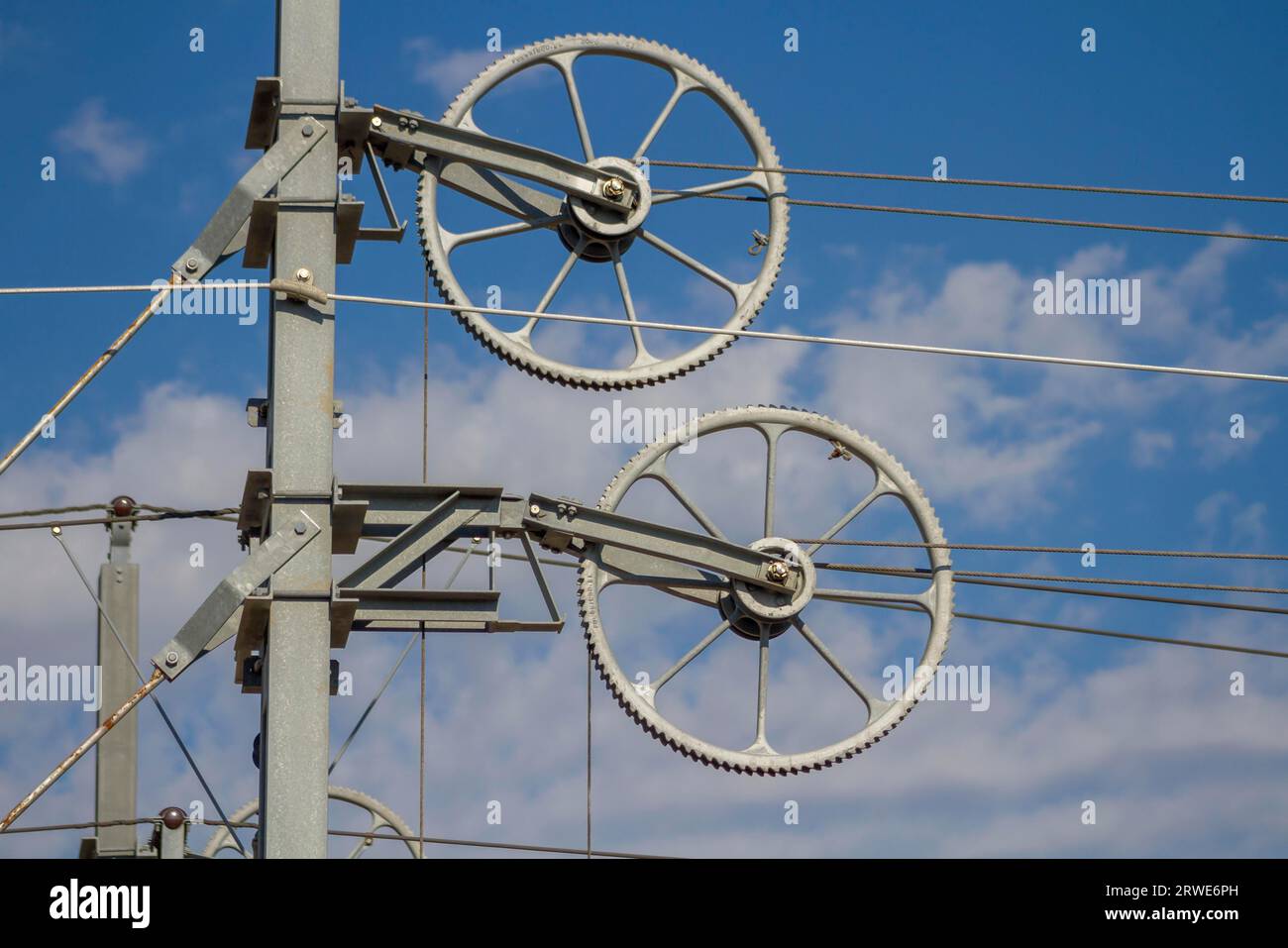 Railway line mast with wheel tensioning station, Majorca Stock Photo ...