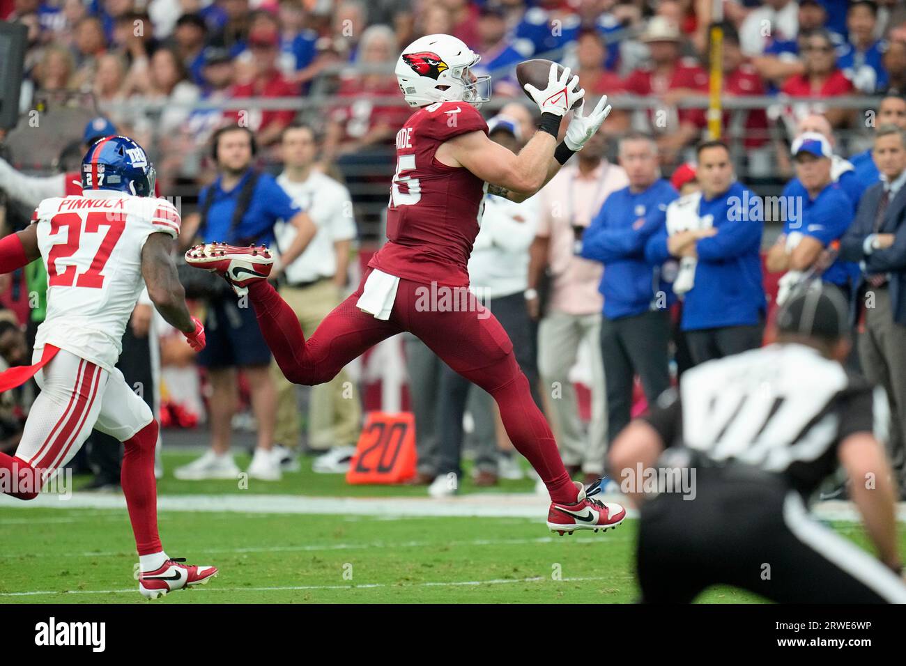 Arizona Cardinals tight end Trey McBride, right, makes a jumps catch ...