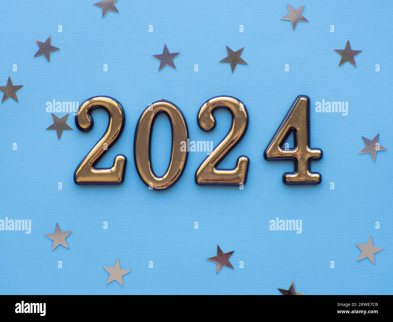 2024 on blue background with silver stars Stock Photo - Alamy