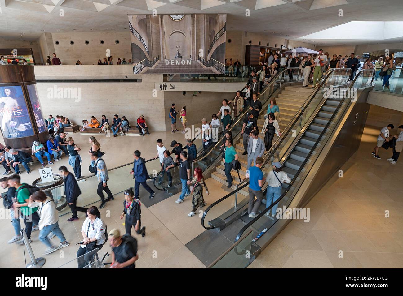 Visitors in the basement of the Louvre pyramid, Paris, France Stock ...