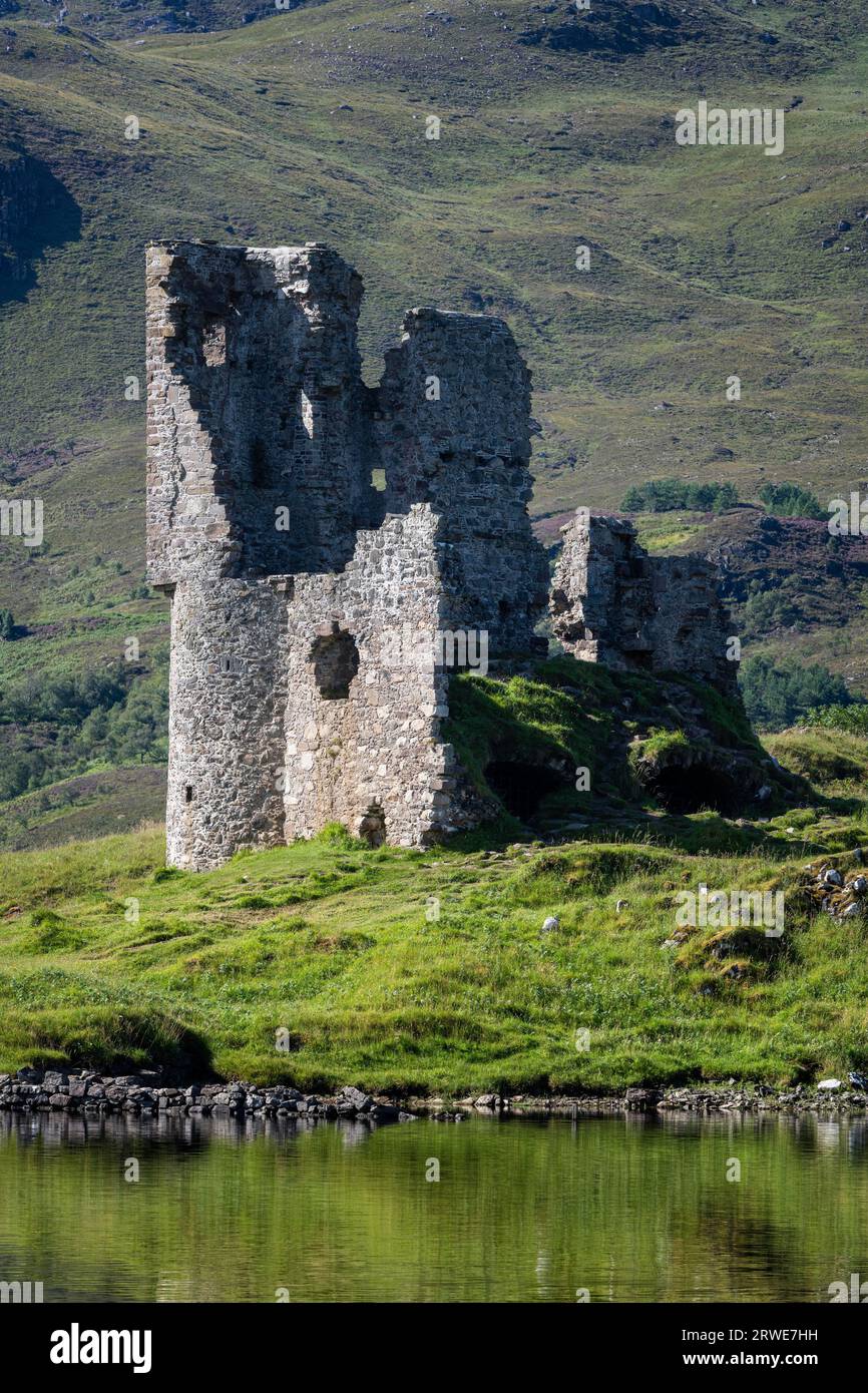 The ruins of Ardvreck Castle on a peninsula in the freshwater loch of ...