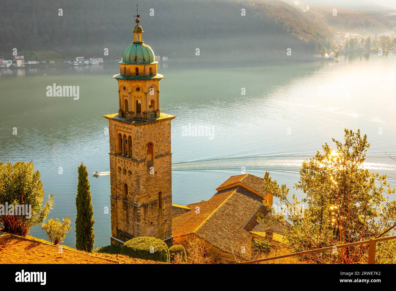 Church Tower Santa Maria del Sasso with Sunlight and Mountain on Lake ...