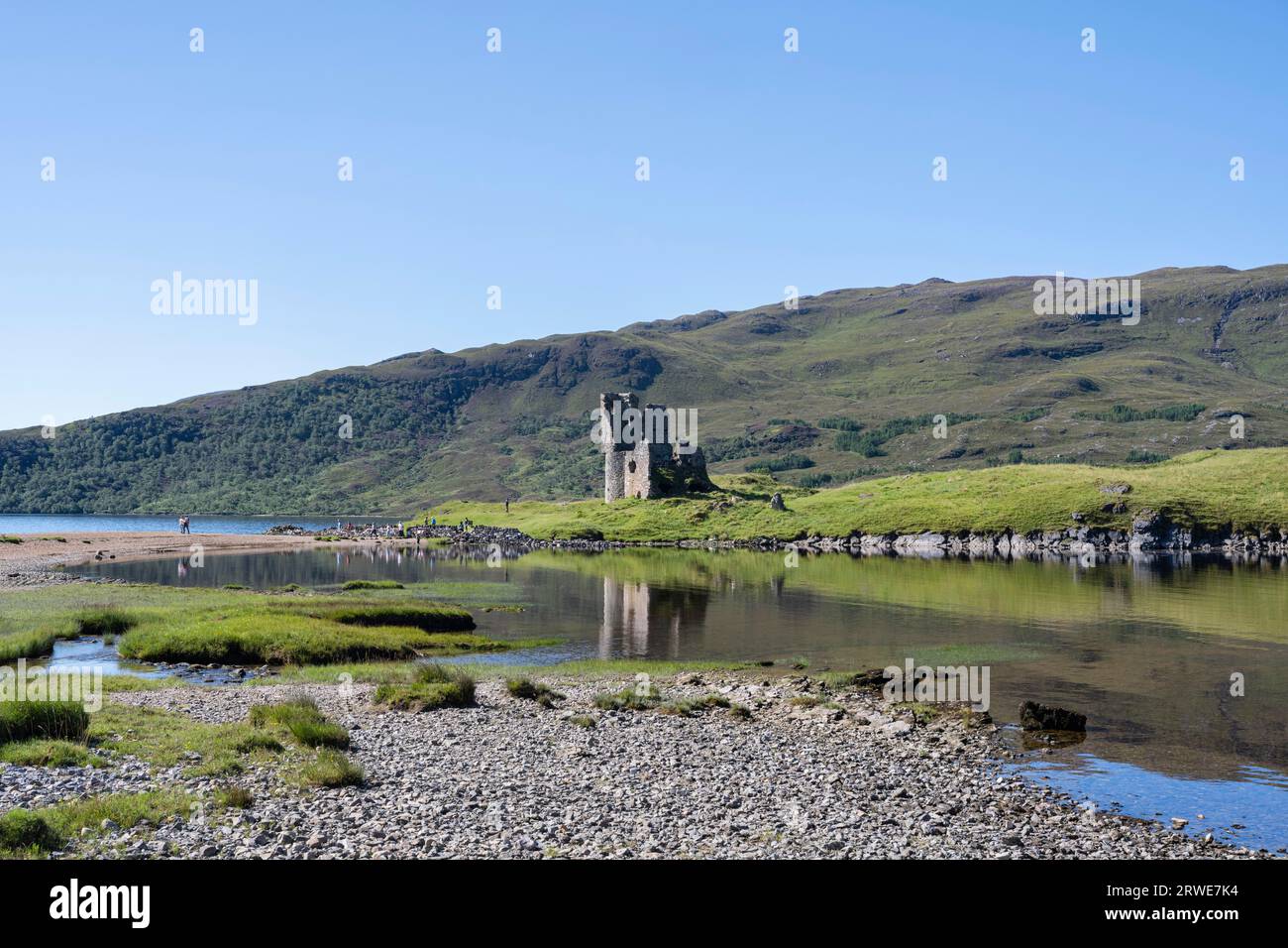 The ruins of Ardvreck Castle on a peninsula in the freshwater loch of ...
