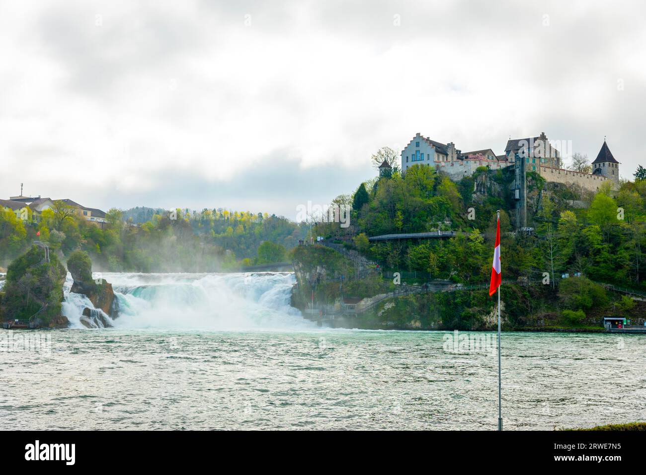 Rhine Falls and Swiss Flag with the Castle Laufen at Neuhausen in ...