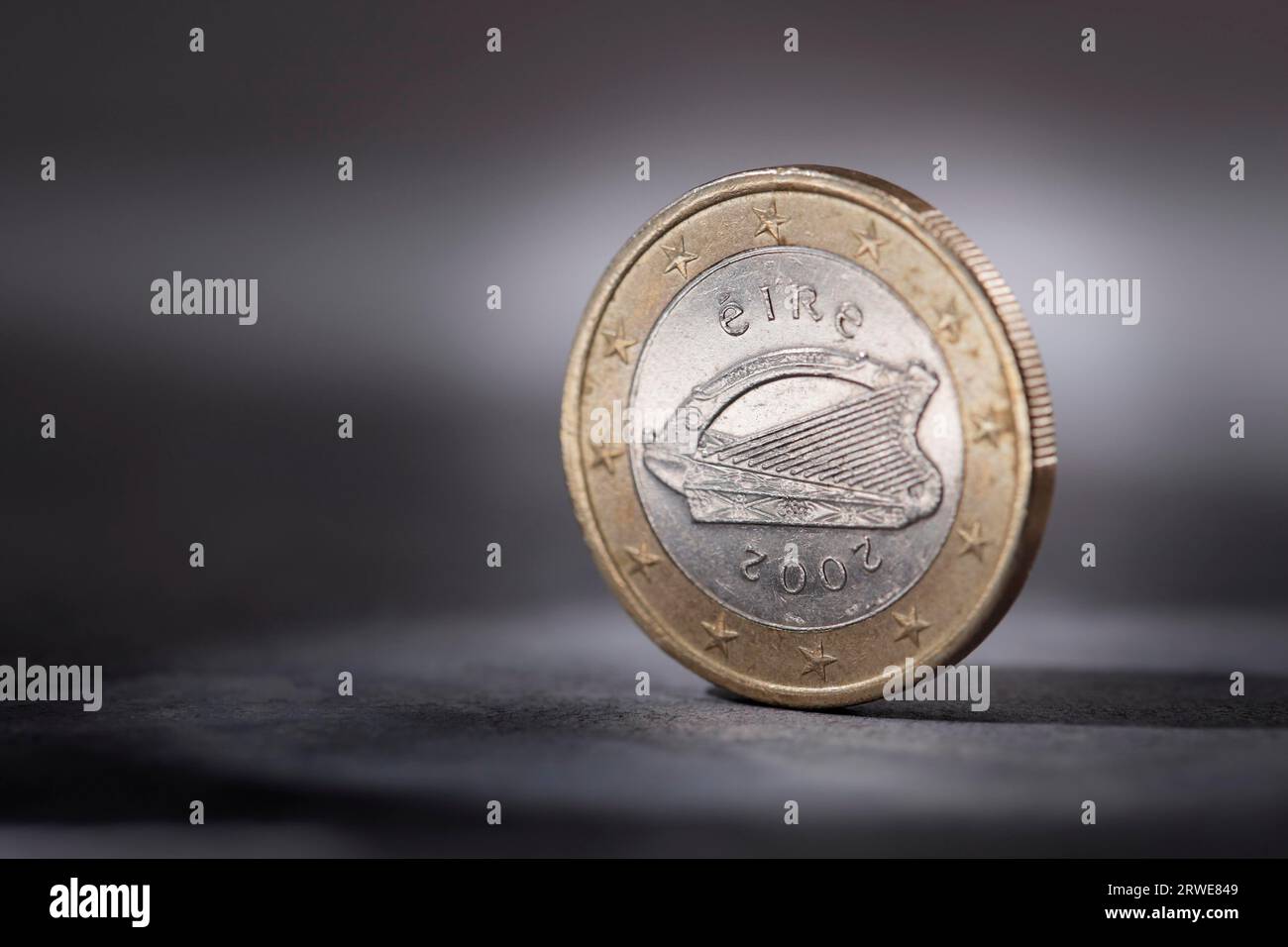 A Worn Irish Euro coin on grey. Short depth of field Stock Photo - Alamy