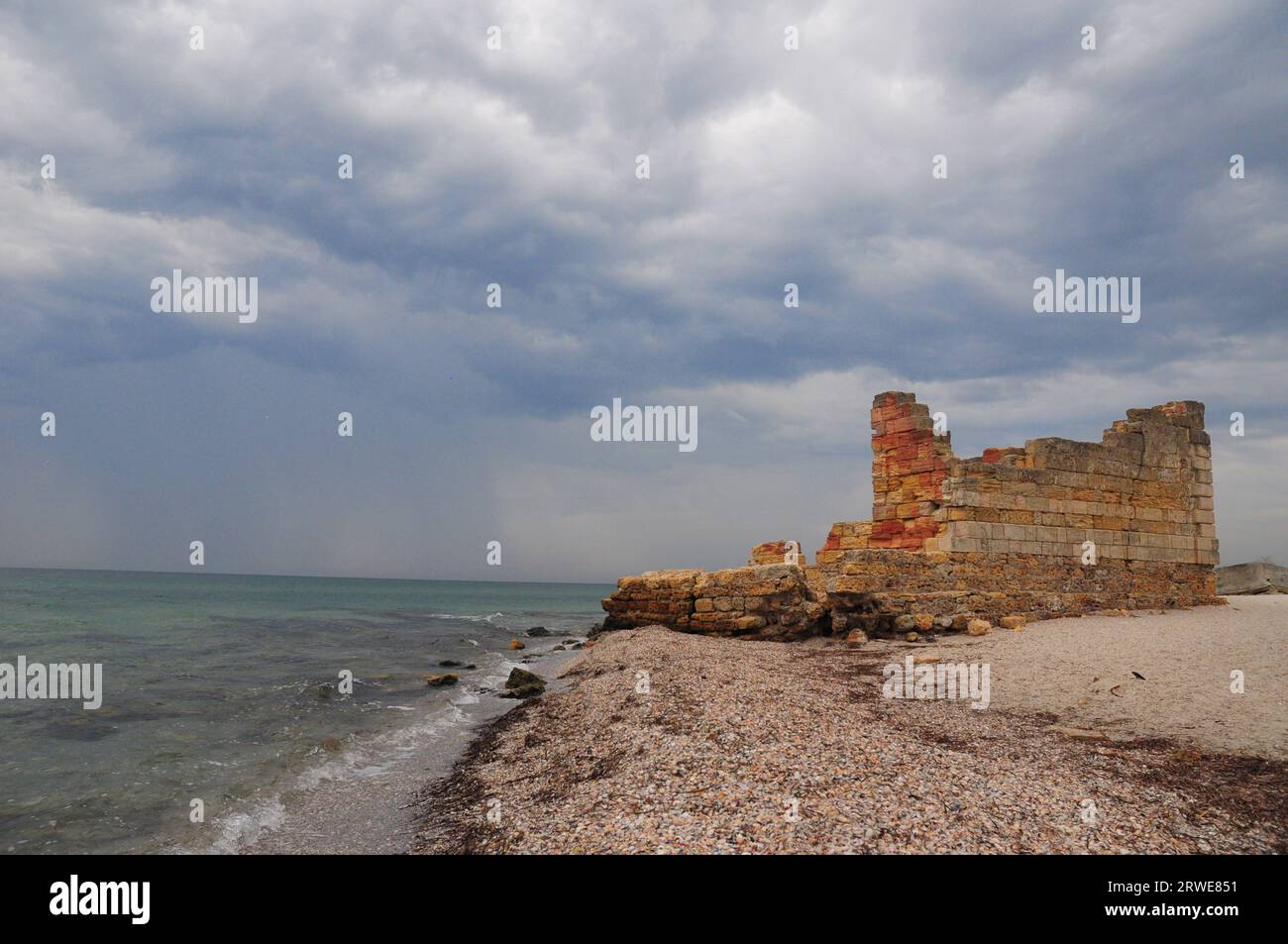 Old ruin on the sea coastline as global flood concept. Earth under ...