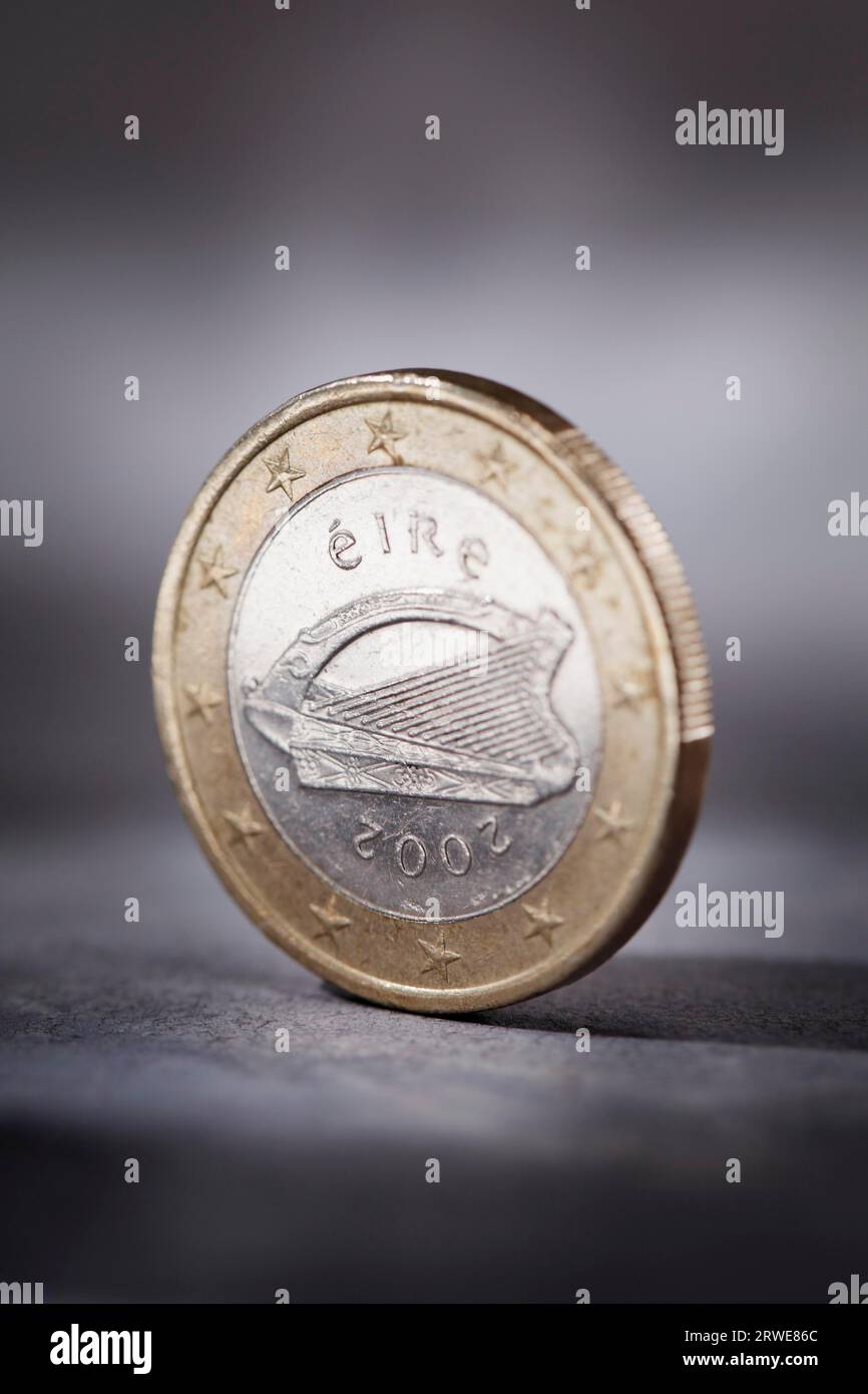 A Worn Irish Euro coin on grey. Short depth of field Stock Photo - Alamy