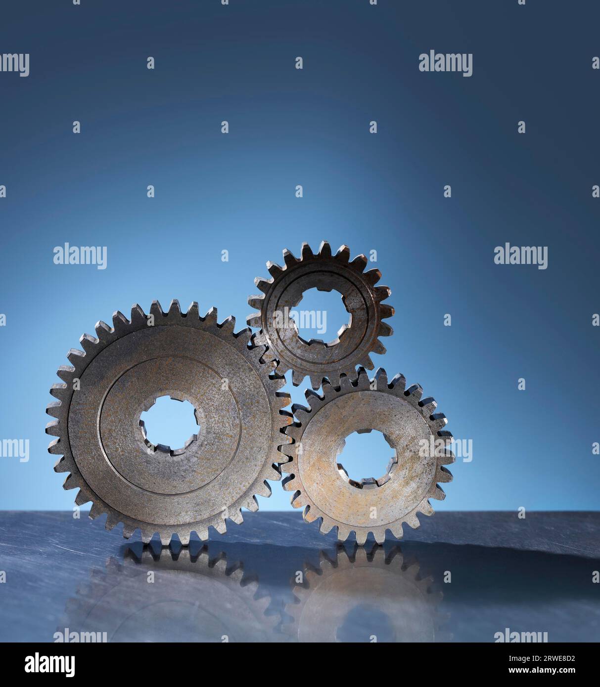 Three old cog gear wheels Stock Photo - Alamy