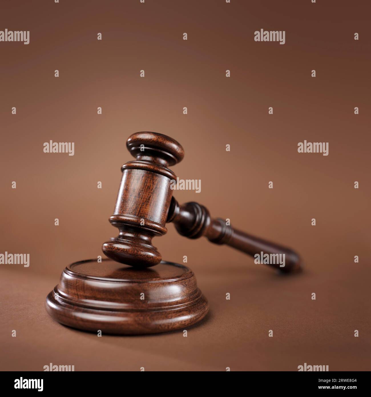 High quality wooden gavel and block on brown background. Short depth-of ...