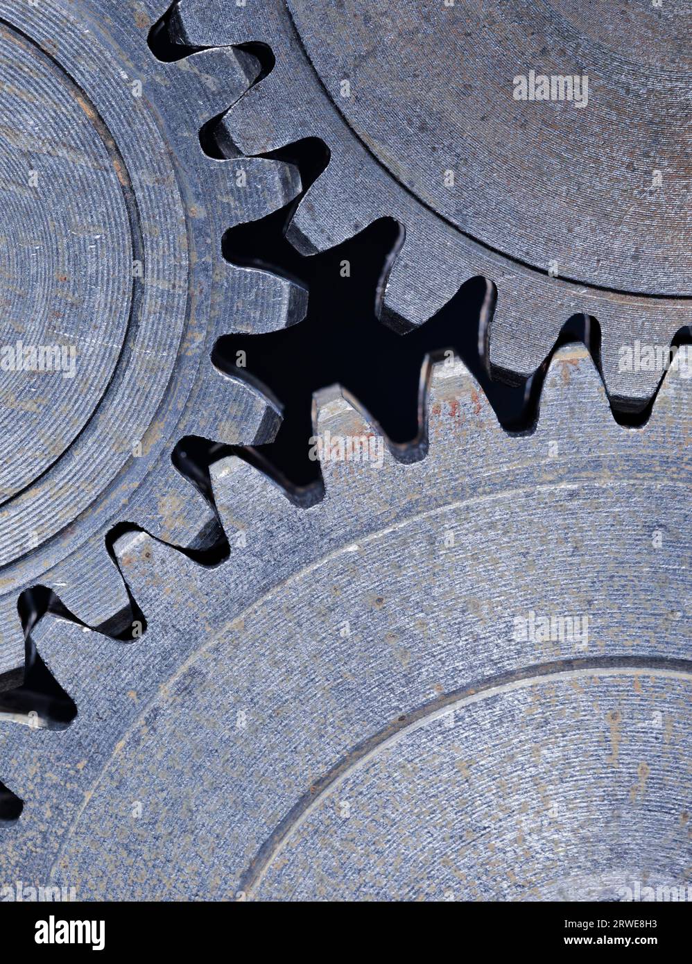 Three old cog gear wheels in closeup Stock Photo - Alamy