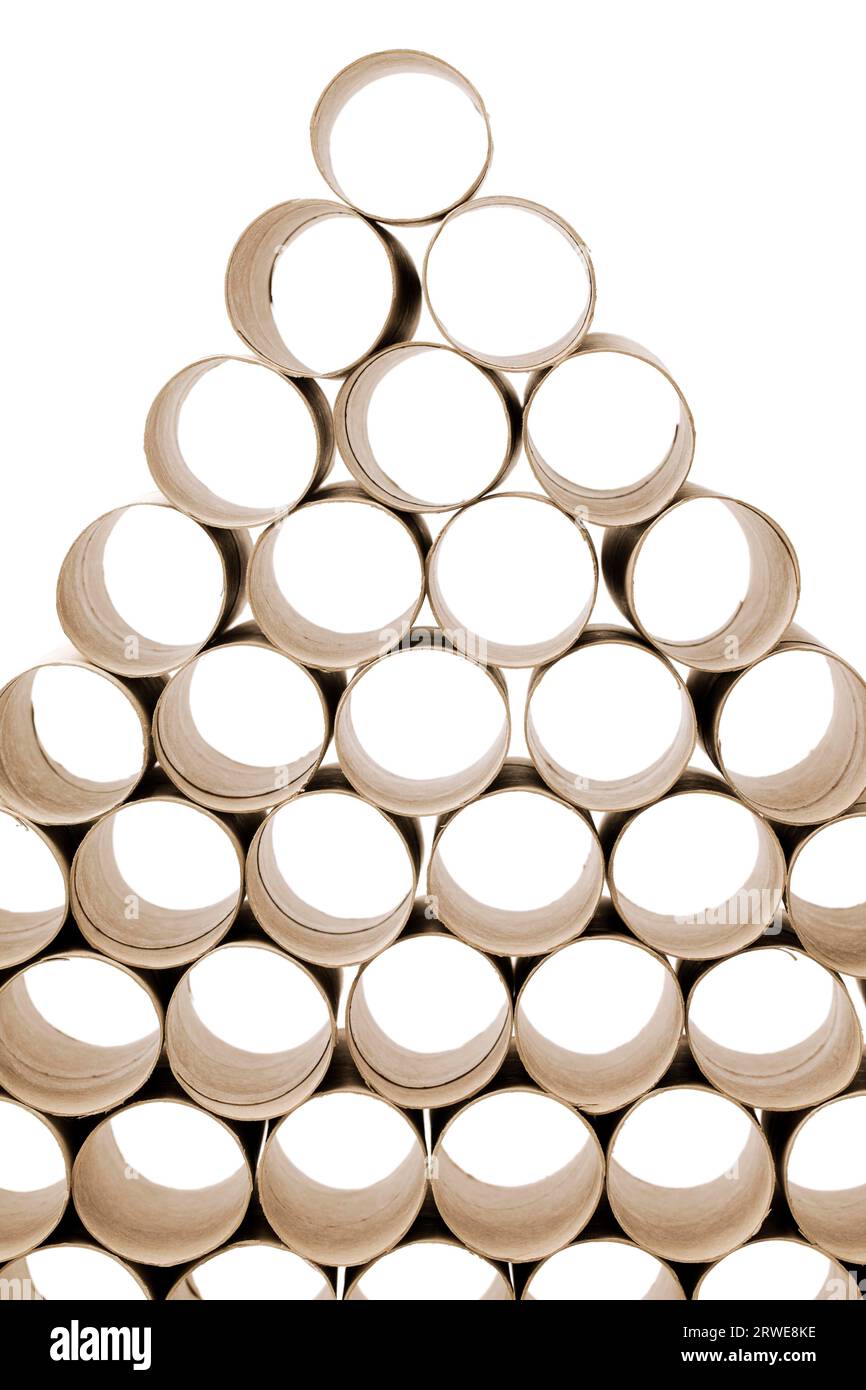 Used empty toilet paper rolls stacked against white background Stock ...