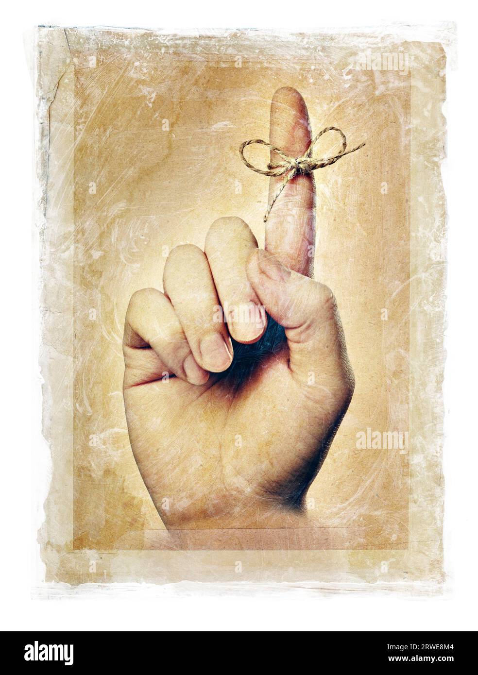 Stained, grainy and gritty image of a hand with a string tied around ...