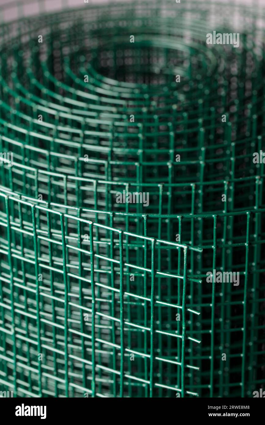 Coated green metallic wire mesh used in gardening by protecting plants ...
