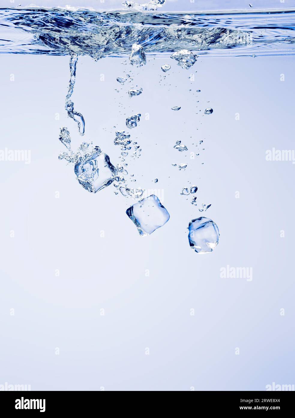 Ice cubes falling in clear water, with bubbles Stock Photo - Alamy