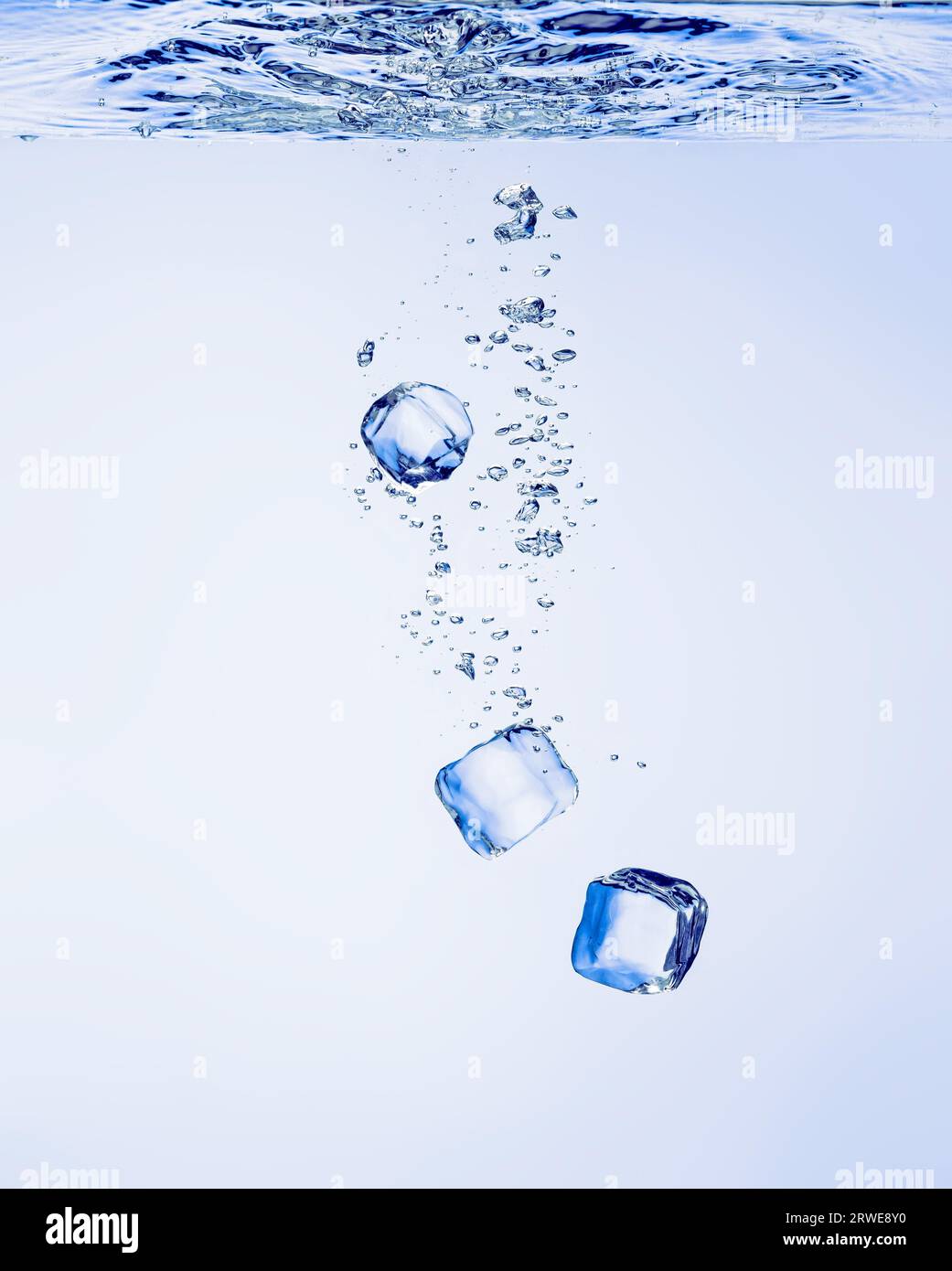 Ice cubes falling in clear water, with bubbles Stock Photo - Alamy