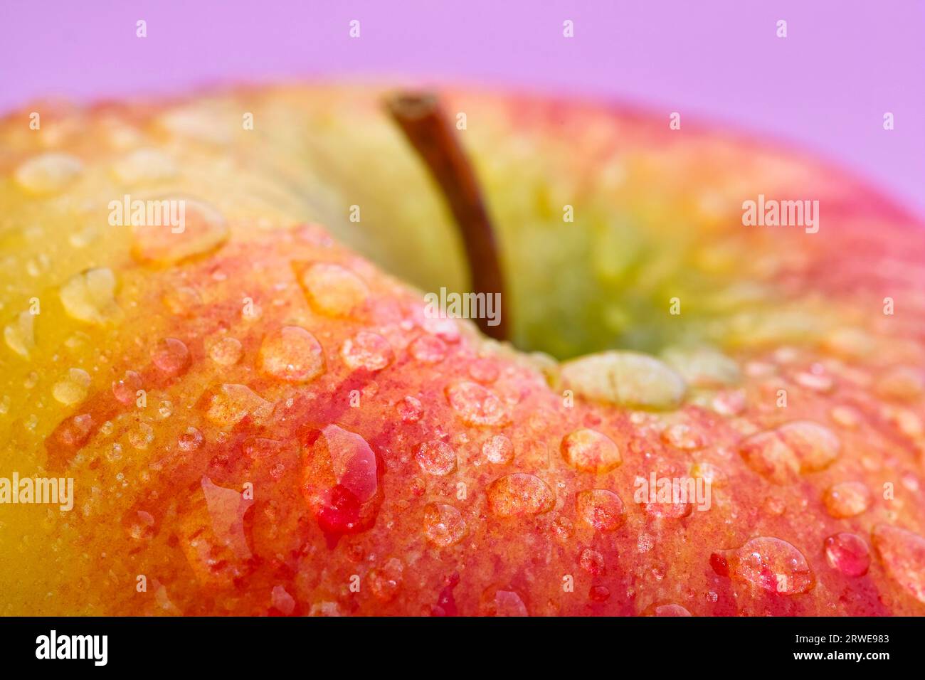 Apple macro with water drop Stock Photo - Alamy