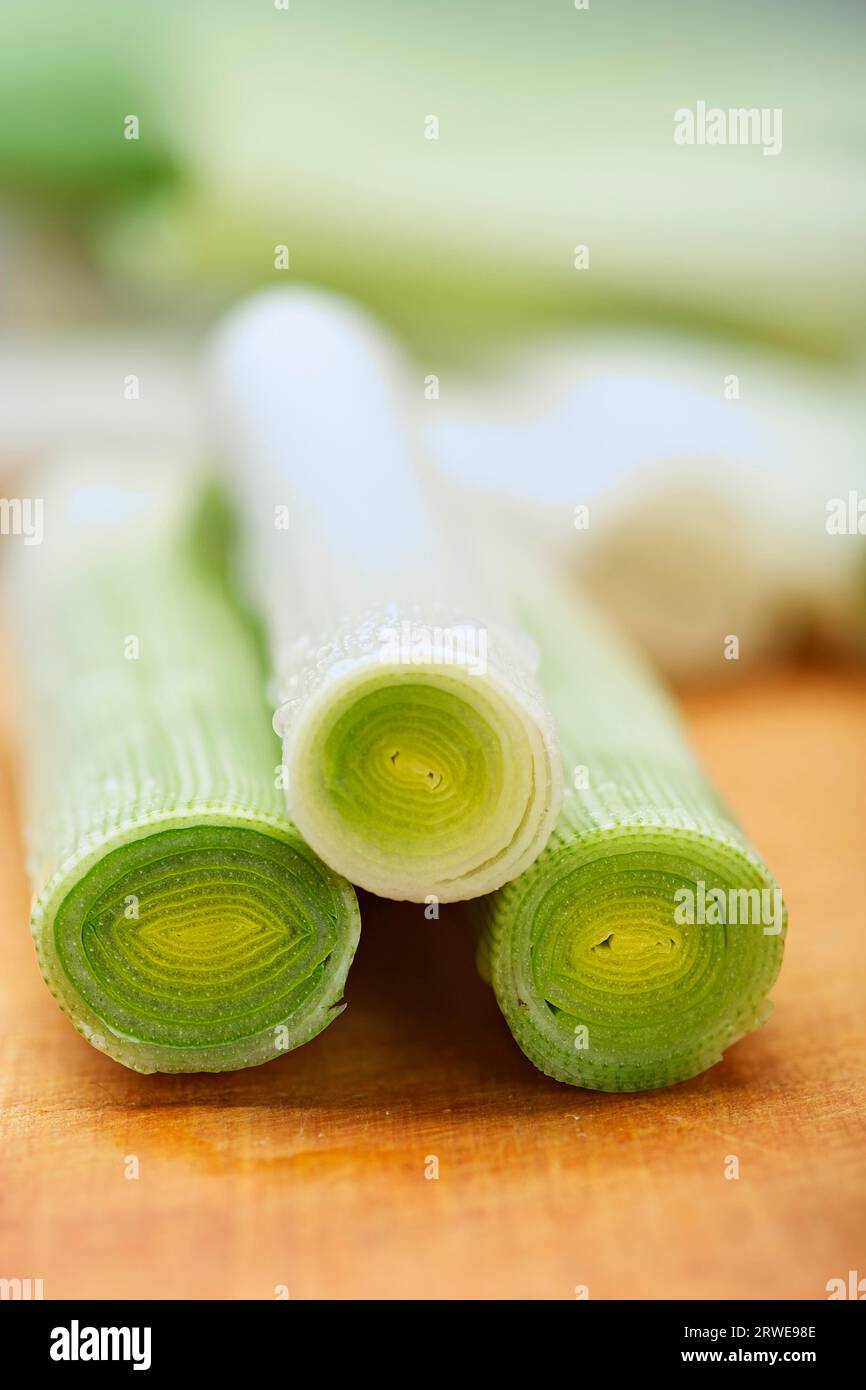 Leek sticks for preparation on a board Stock Photo - Alamy